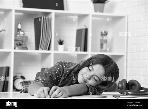 Tired And Bored Teenager School Girl Schoolgirl Is Sleeping While
