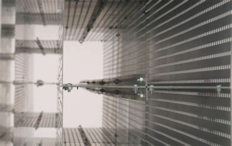 Premium Photo Building Seen Through Glass Ceiling