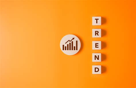 나무 블록에 Trend 텍스트 주황색 배경에 그래프와 위쪽 화살표 기호가 있는 막대 차트입니다 마케팅 전략 기획 관리 재무 투자 및 개발을 위한 비즈니스 데이터 분석 세일에