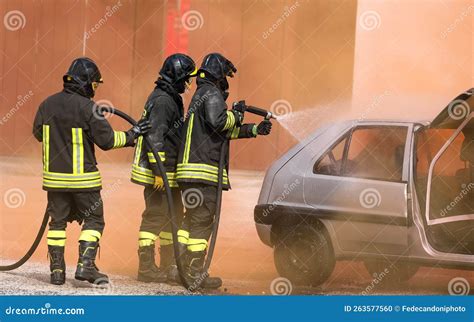 Firefighters Extinguish The Fire Of The Crashed Car After The Accident Stock Photo Image Of