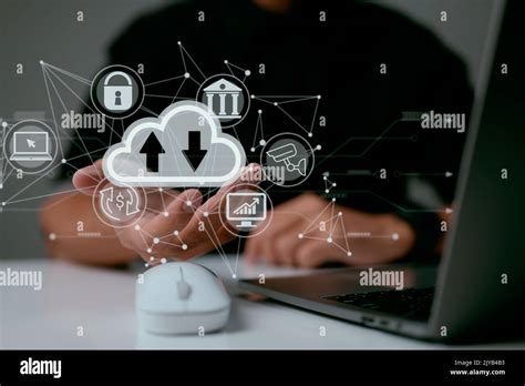 A Man Uses A Laptop With A Cloud Computing Diagram Shown On Hand Cloud Computing Networking And