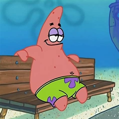 Spongebob Is Sitting On A Bench In The Middle Of The Ocean With His