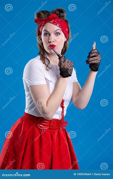 Beautiful Retro Vintage Pin Up Girl Paints Her Lips With Lipstick With