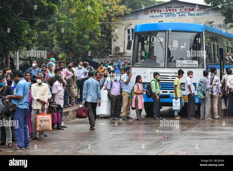 Commuters Wait To Board A Bus Following No Social Distance Norms With Many Seen Without