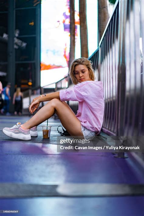 Las Vegas Girl Female Sits On The Sidewalk Smokes Drinks Coff High Res