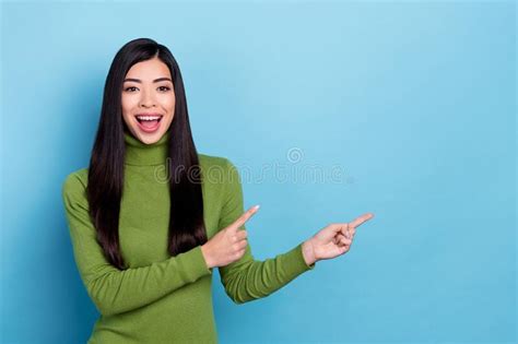 Portrait Of Attractive Cheerful Long Haired Girl Demonstrating New