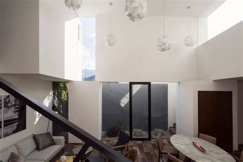 Arquidromo Stacks White Cubes To Form Mexican House On Angled Plot