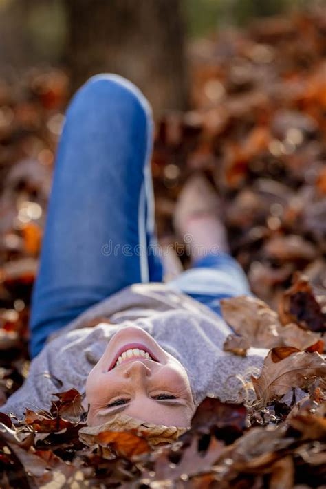 A Lovely Blonde Model Poses Outdoor While Enjoying The Fall Weather