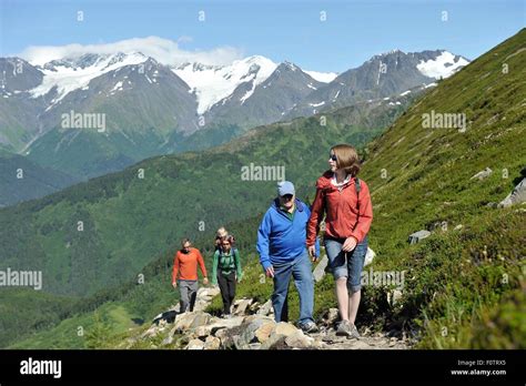 People Hiking North Face Trail Alyeska Resort Seven Glaciers Winner