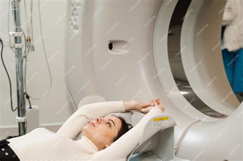 Premium Photo Girl Patient Lies On Computed Tomography Bed And