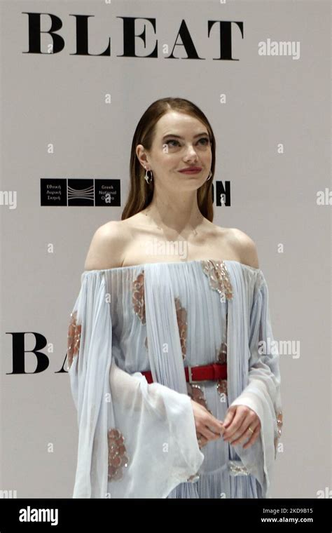 Actress Emma Stone And Pose For Photographers Before The Premiere Of