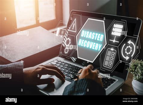 Disaster Recovery Concept Person Hand Using Laptop Computer With Disaster Recovery Icon On