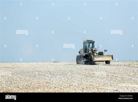 Industrial Tractor Grading Surface Prepearing It For Further