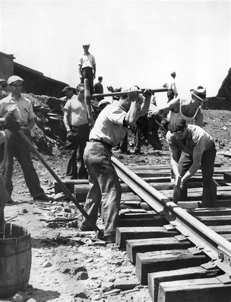 Men Working Near Railroad Tracks