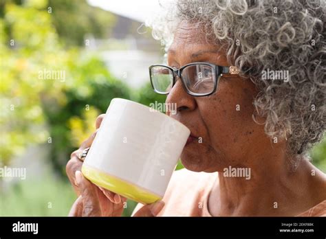 Close Up Of Thoughtful African American Senior Woman Holding Coffee Cup