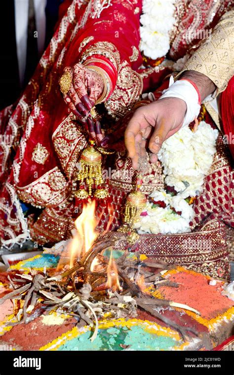 A Hindu Couple Performing Saat Phere Seven Vows Of Hindu Marriage