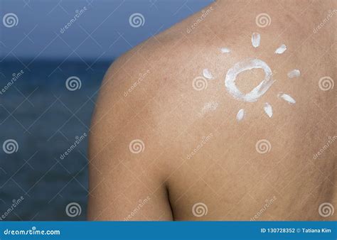 Sunscreen On A Man`s Back Close Up Skin Care And Protection From The