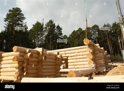 Assembly Of A Wooden Log House At A Construction Base Stock Photo Alamy