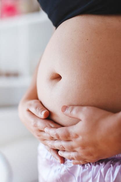 Premium Photo Close Up Of A Cute Pregnant Belly