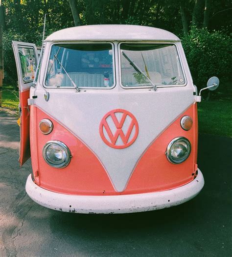Orange And White Vw Bus Parked On The Street