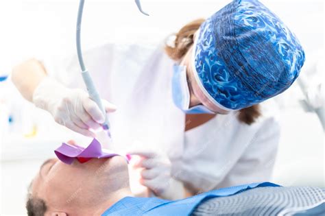 Premium Photo Dental Clinic A Doctor Performing A Root Canal To A