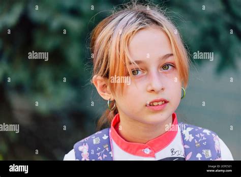 A Portrait Of A 9 Almost 10 Year Old Girl On A Neutral Background
