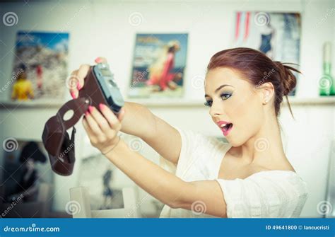 Beautiful Smiling Red Hair Woman Taking Photos Of Herself With A Camera Fashionable Attractive