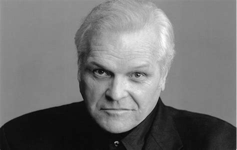 Download Legendary Actor Brian Dennehy In Front Of A Gray Background Wallpaper