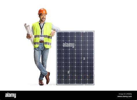 Engineer With Blueprints Leaning On A Solar Panel Isolated On White