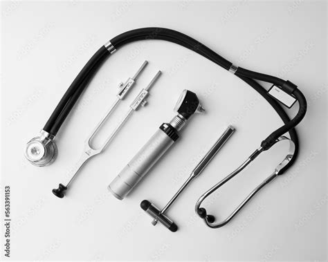 Tuning Fork C 128 On A White Background With Gradation Otorhinoscope Neurological Hammer And