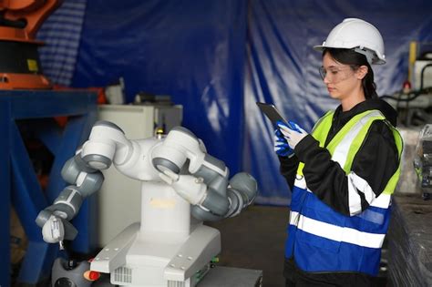 Premium Photo Female Engineer Check And Control Automation Robot Arms Machine In Intelligent