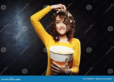 Funny Girl Eating Popcorn While Watching Shows At Home Party Stock