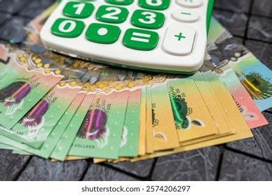 Australian Different Dollar Bill Over Calculator Stock Photo