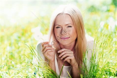 In Spring Parkhappy Blonde Girl In Spring Park Holding White Dandelion