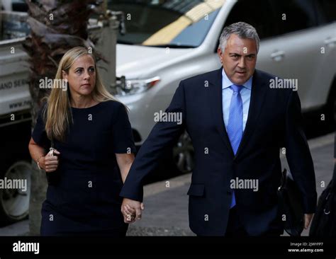 Australian Treasurer Joe Hockey Right Arrives At Federal Court With His Wife Melissa Babbage