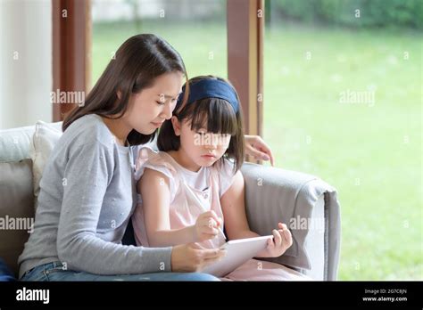 Asian Mom Teaching Telegraph