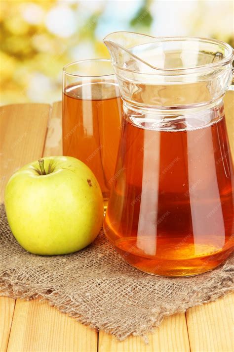 Premium Photo Full Glass And Jug Of Apple Juice And Apple On Wooden