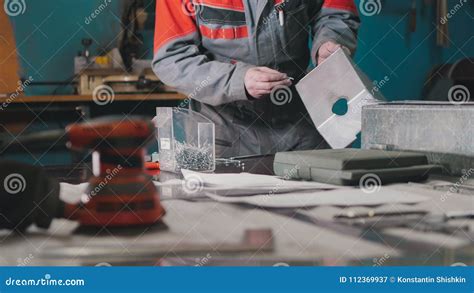 Worker Assembling The Metal Part In The Manual Stock Image Image Of