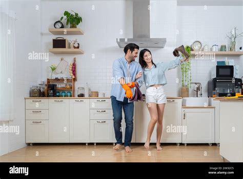 Cleaning Concept Cheerful Young European Lady And Male Washing Dishes