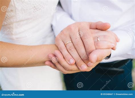 Lovers Holding Hands With Gold Wedding Rings Stock Image Image Of