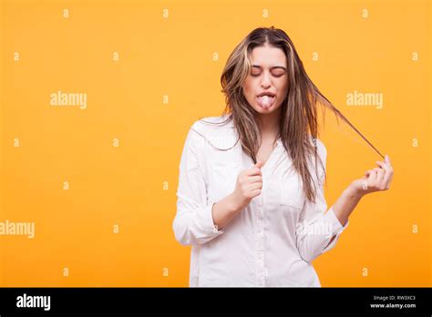 Portrait Of Beautiful Girl Making Funny Faces And Sticking Her Tongue