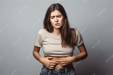 Premium Photo A Woman Has A Stomach Ache