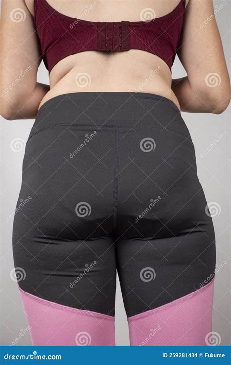 Overweight Female Buttocks In Black Leggings Closeup Exercise For