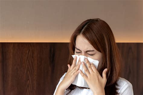 Asian Woman Suffering From Runny Nose Or Nasal Blocking Common Cold Or