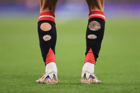 Why Footballers Cut Holes In Their Socks Trend Involving Bukayo Saka