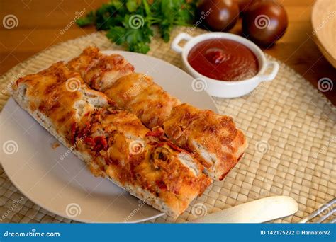 Close Up Of Focaccia Bread On A Kitchen Table With Tomatoes Tomato