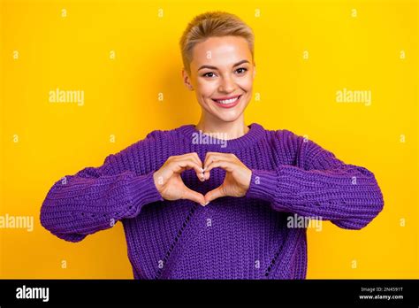 Photo Of Candid Cute Blonde Short Hair Woman Showing Fingers Love