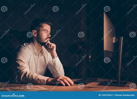 Photo Side Profile Of Serious Pensive Programmer Working Overtime