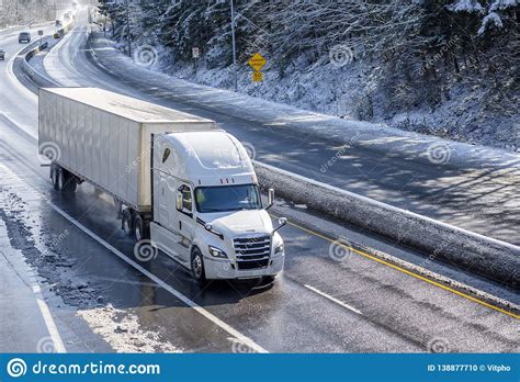 Big Rig White Bonnet Semi Truck With Dry Van Semi Trailer Moving On The