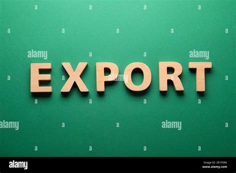 Word Export Made Of Wooden Letters On Green Background Flat Lay Stock